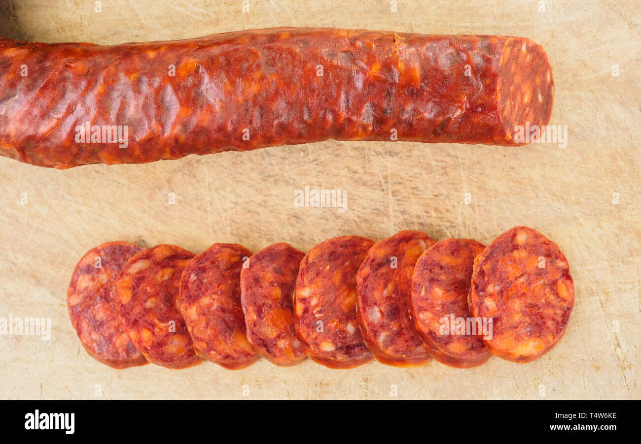 Iberian chorizo, Spanish chorizo or Spanish sausage cut into slices on ...