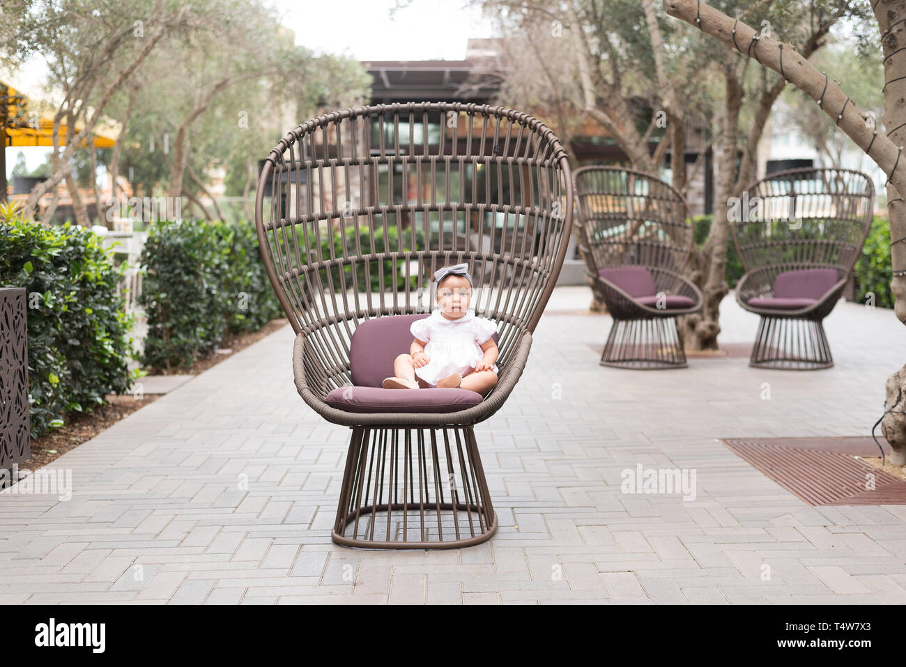 baby sitting outside Stock Photo - Alamy