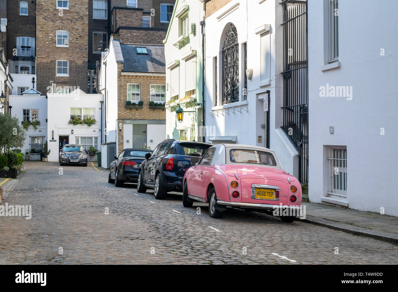 1991 pink Nissan figaro car parked in Elvaston Mews, South Kensington ...
