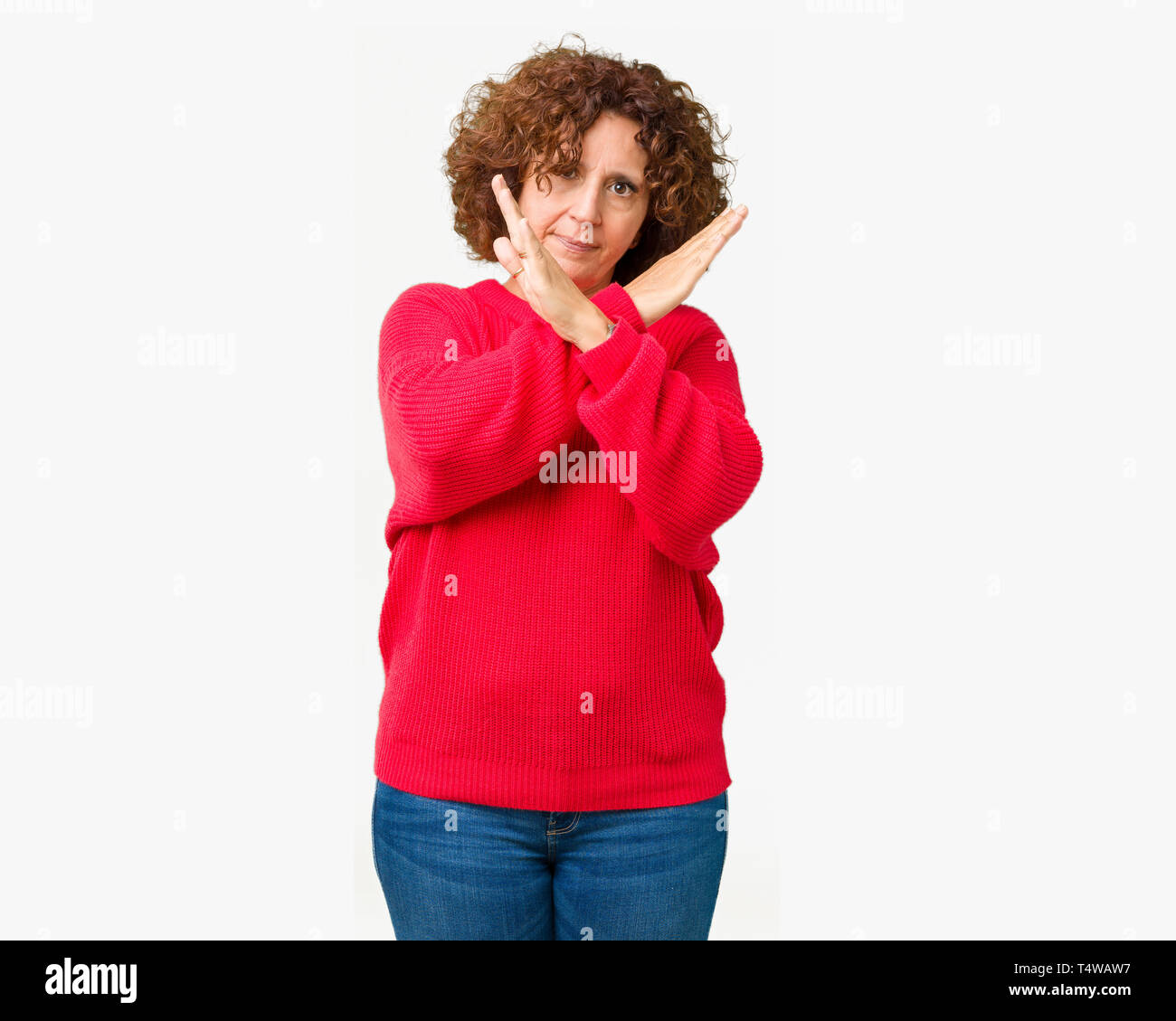 Beautiful middle ager senior woman red winter sweater over isolated ...