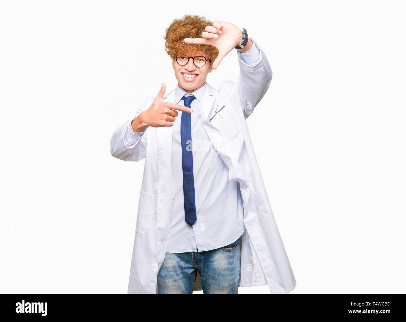 Young handsome scientist man wearing glasses smiling making frame with ...
