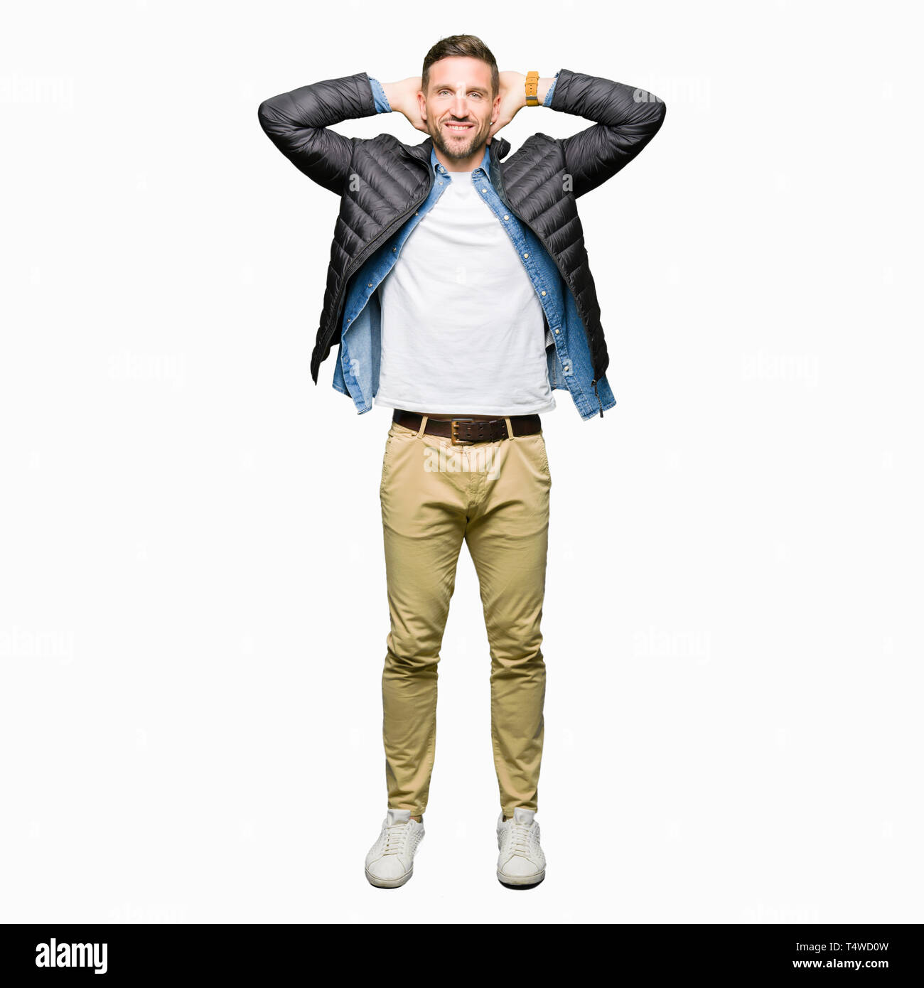 Handsome man wearing winter coat Relaxing and stretching with arms and ...