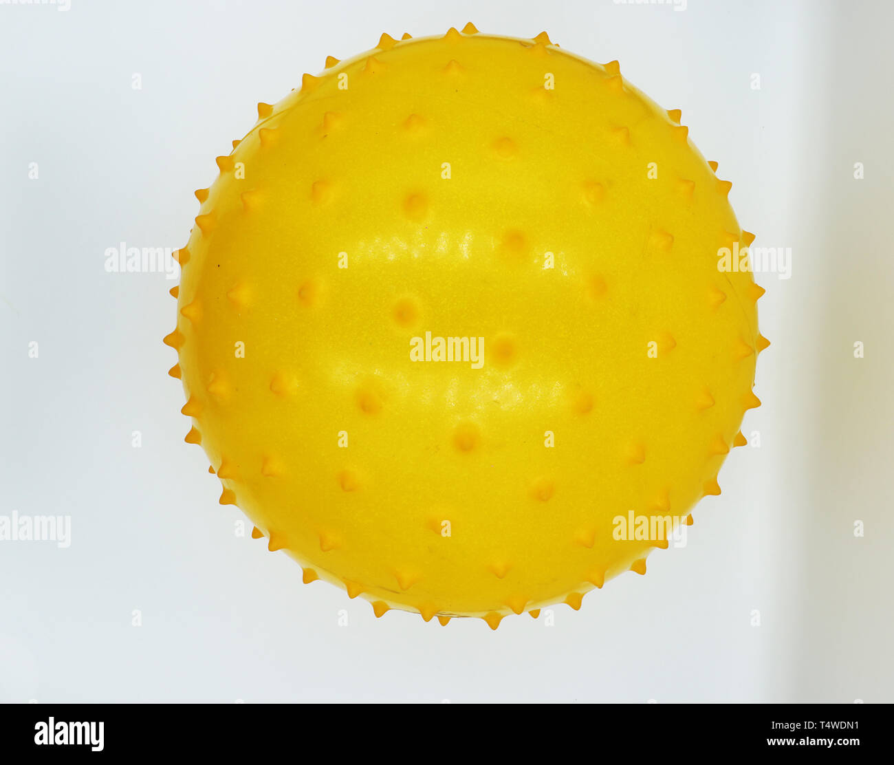 yellow ball isolated on white background Stock Photo - Alamy
