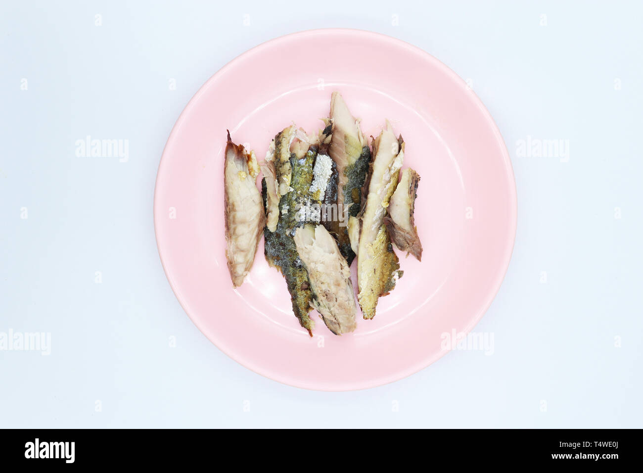 fried mackerel meal in pink dish isolated on white background Stock ...