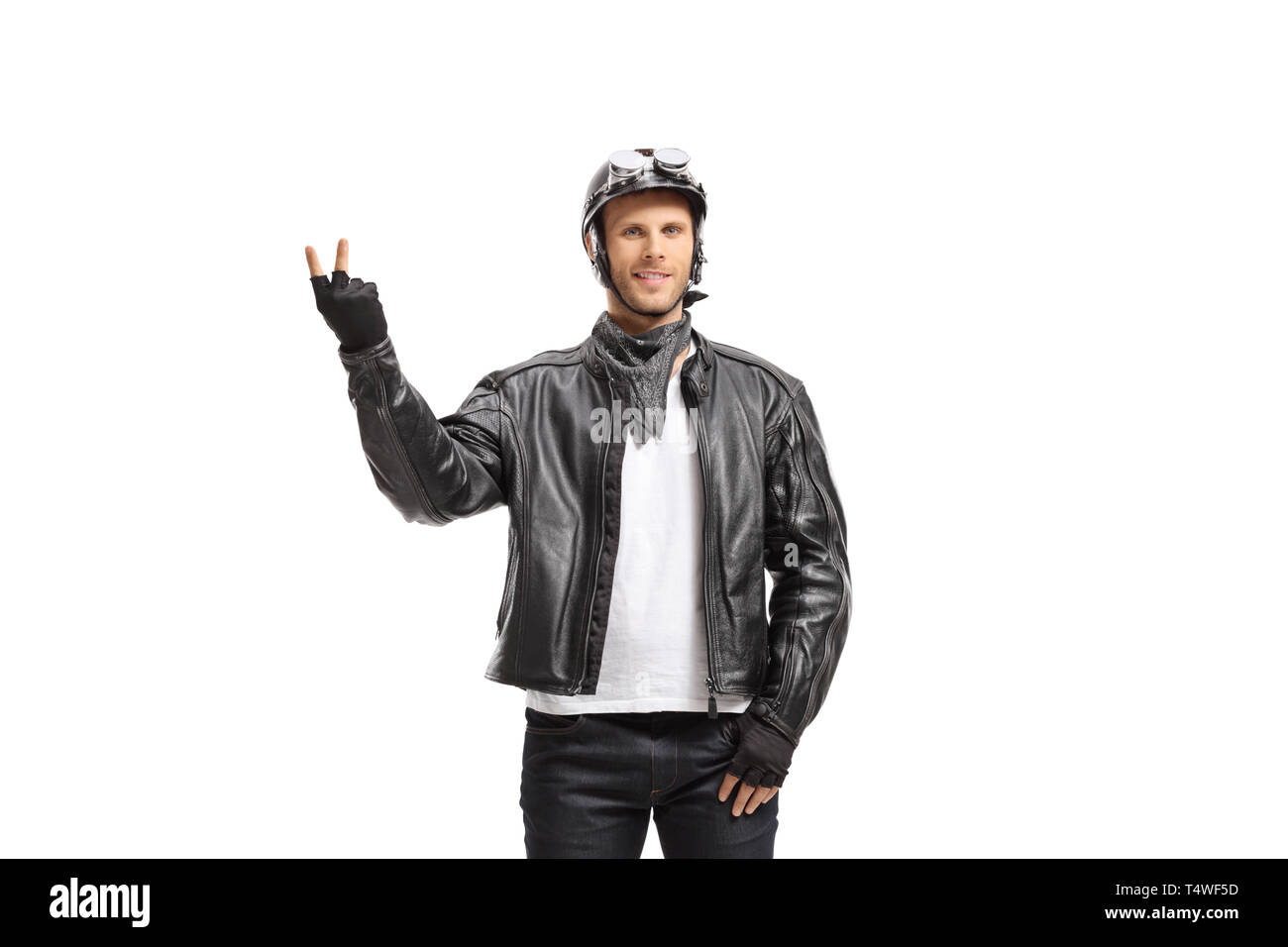 Young biker making a peace gesture isolated on white background Stock ...