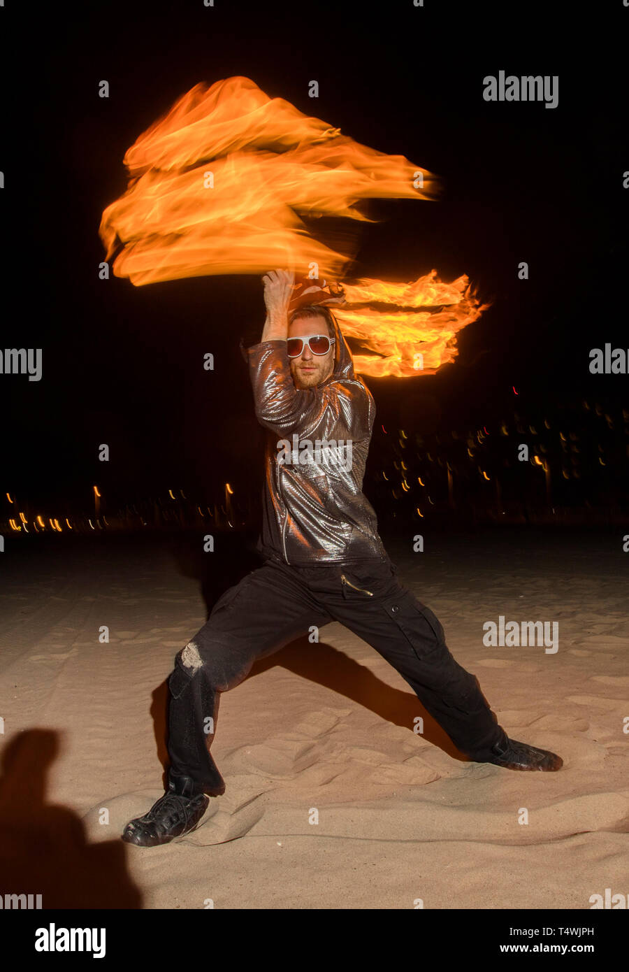 Fire performer, Venice Glow Flow event, Venice, California, USA Stock ...