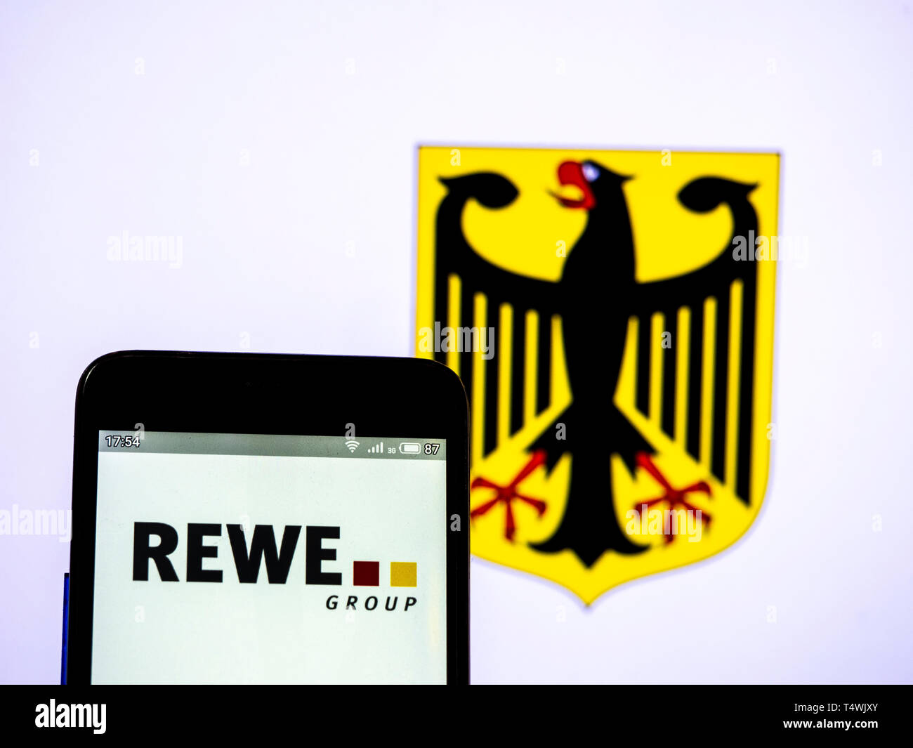 In this photo illustration a REWE Group logo seen displayed on a smart ...