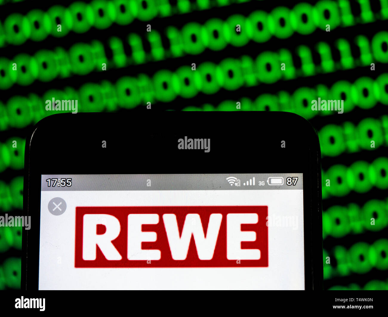 In this photo illustration a REWE Group logo seen displayed on a smart ...