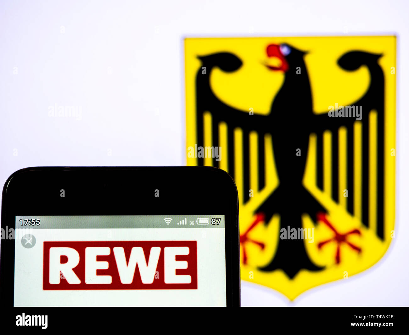 In this photo illustration a REWE Group logo seen displayed on a smart ...