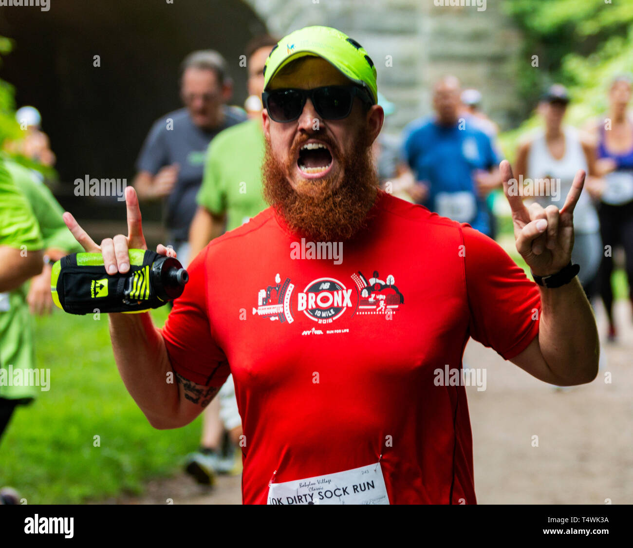 Babylon, New York, USA, - 12 August 2018: A runner racing a 10,000 ...