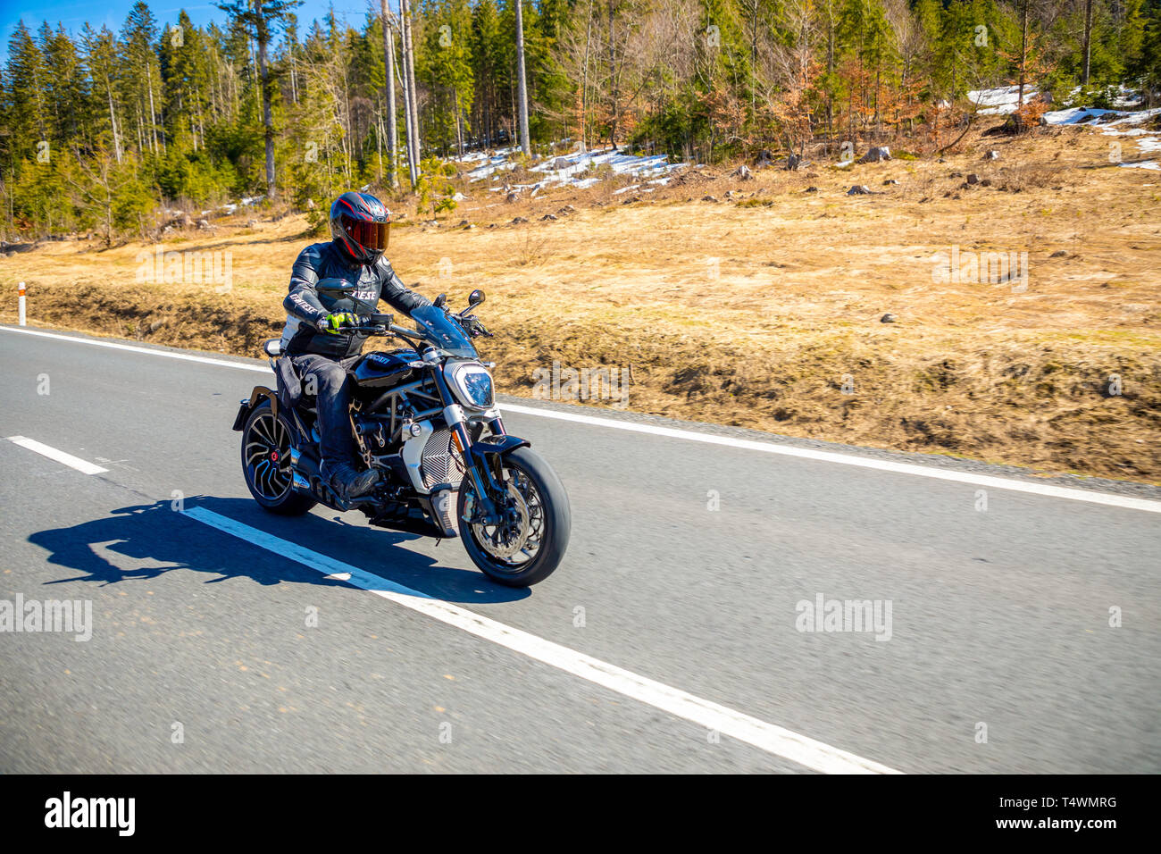 Grosser Arber, Germany - 30.03.2019: Motorcyclist biker riding ...