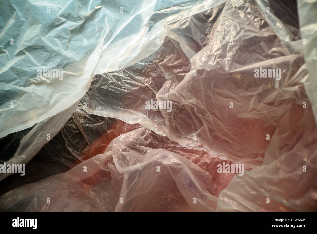 Inside a disposable plastic bag. Lightweight transparent, reusable plastic waste. Rubbish bag ...