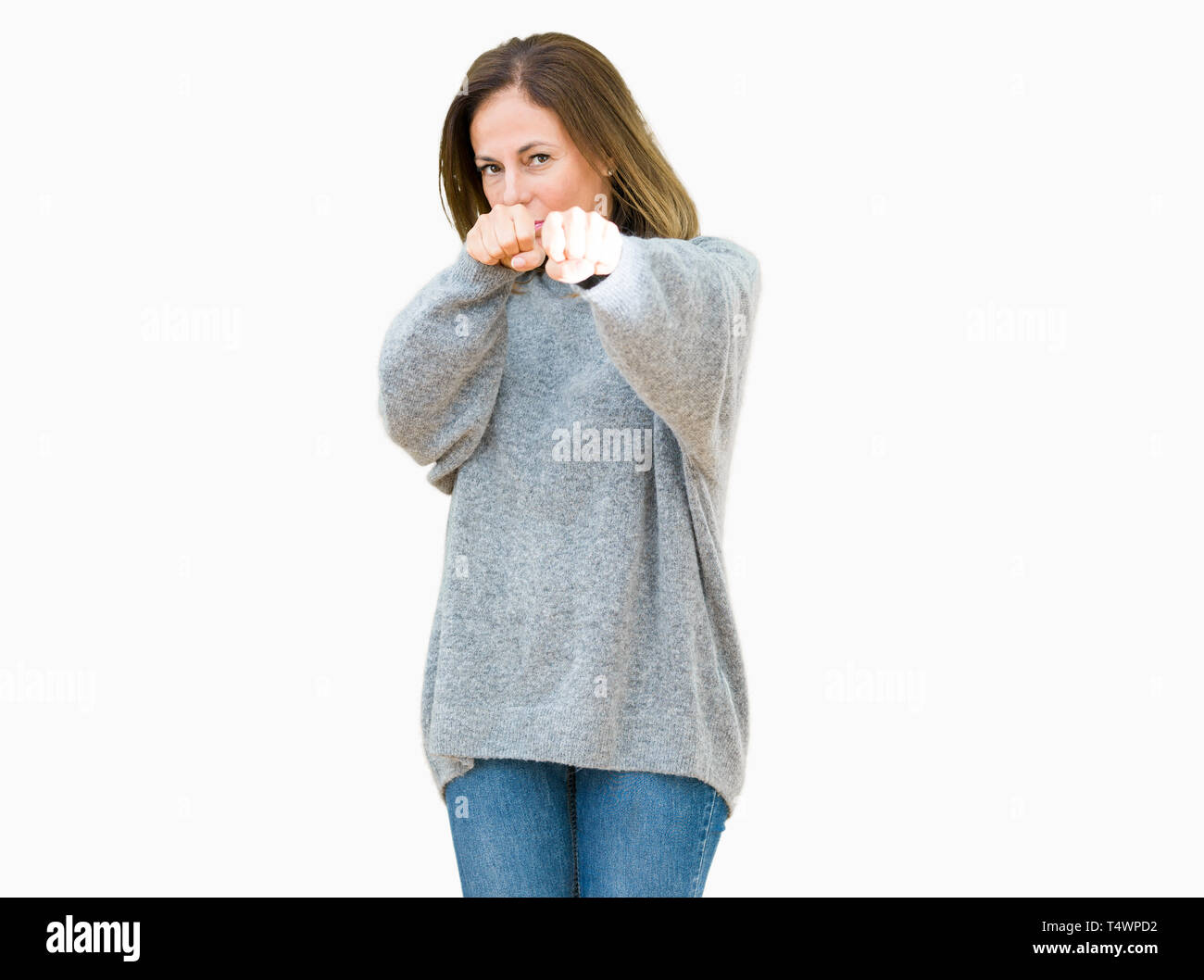 Beautiful middle age woman wearing winter sweater over isolated ...