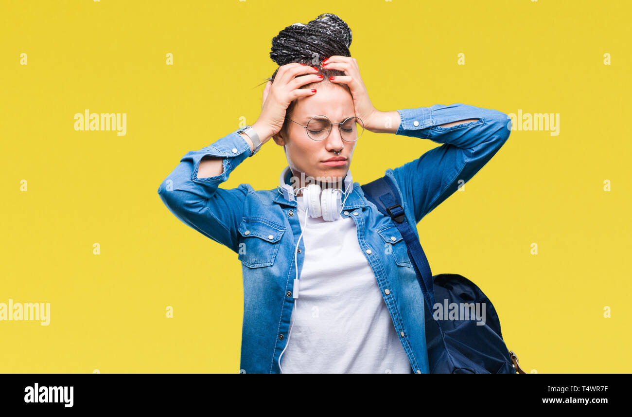 Young braided hair african american student girl wearing backpack over ...