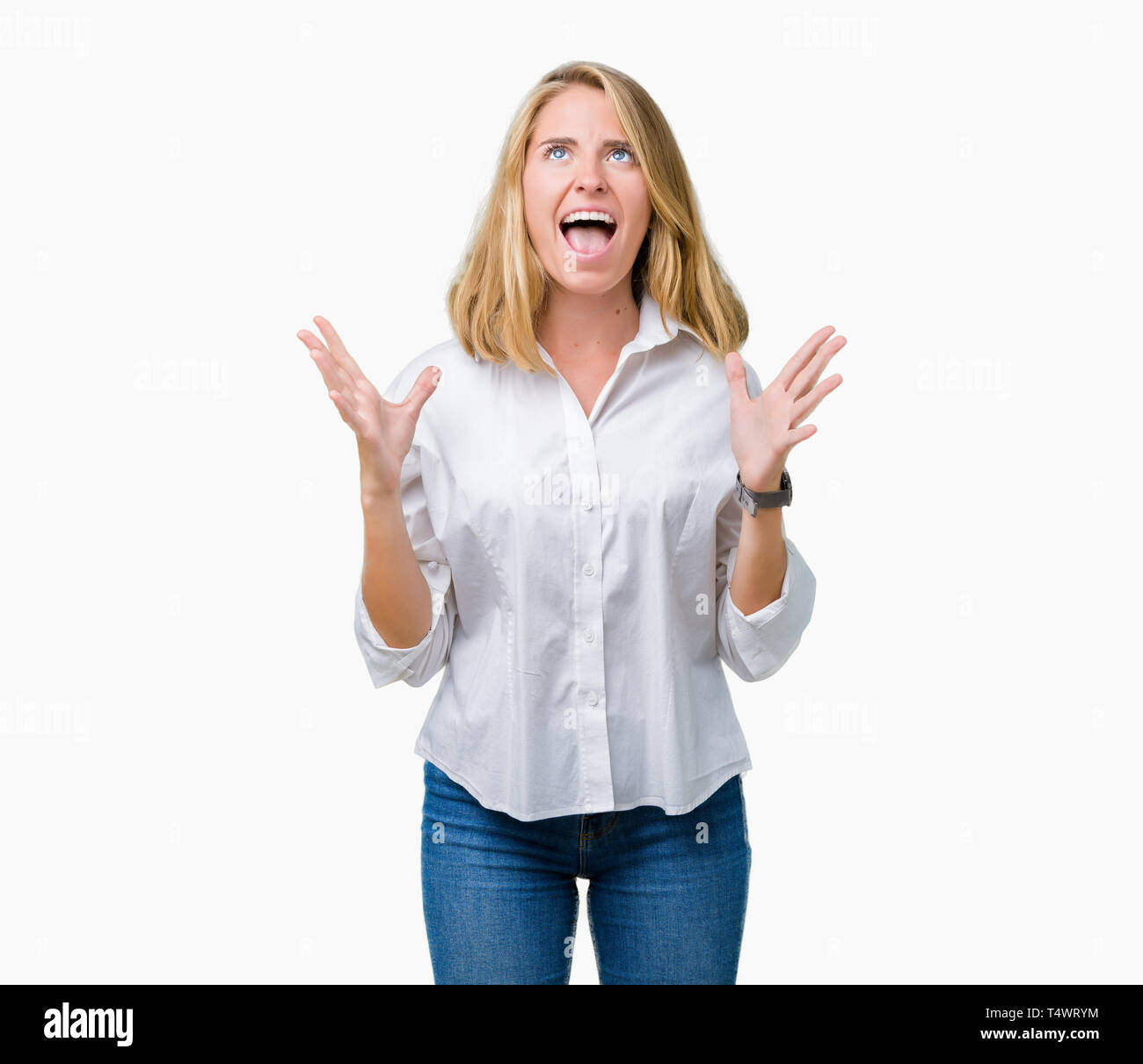 Beautiful young business woman over isolated background crazy and mad ...
