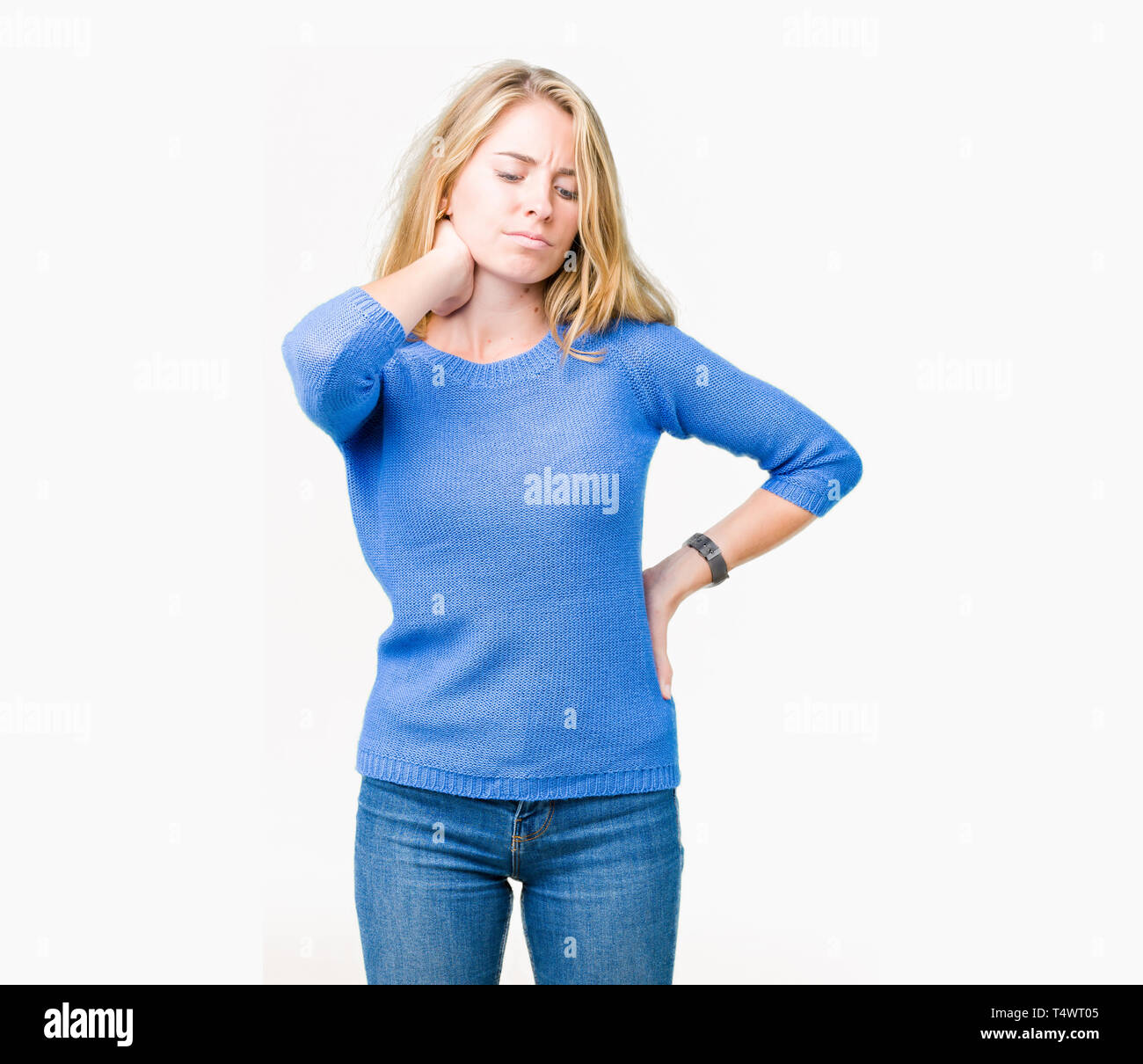 Beautiful young woman wearing blue sweater over isolated background ...