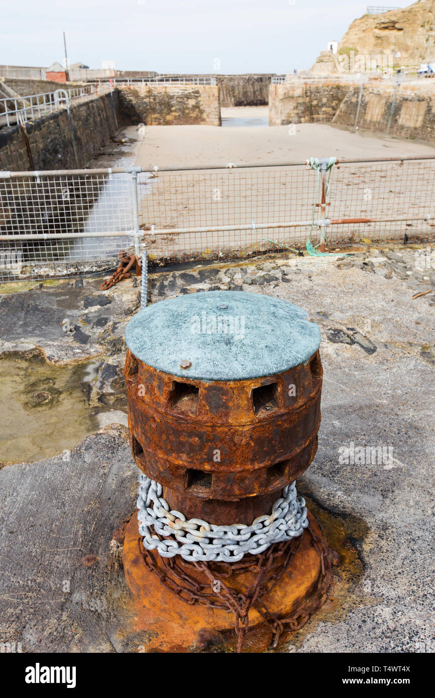 A capstan in the harbour in Portreath, Cornwall, UK Stock Photo - Alamy