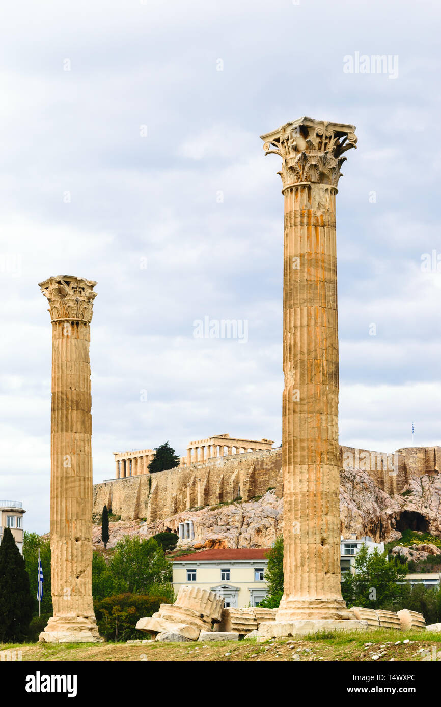 Acropolis view between two pillars of Olympian Zeus temple in cloudy ...