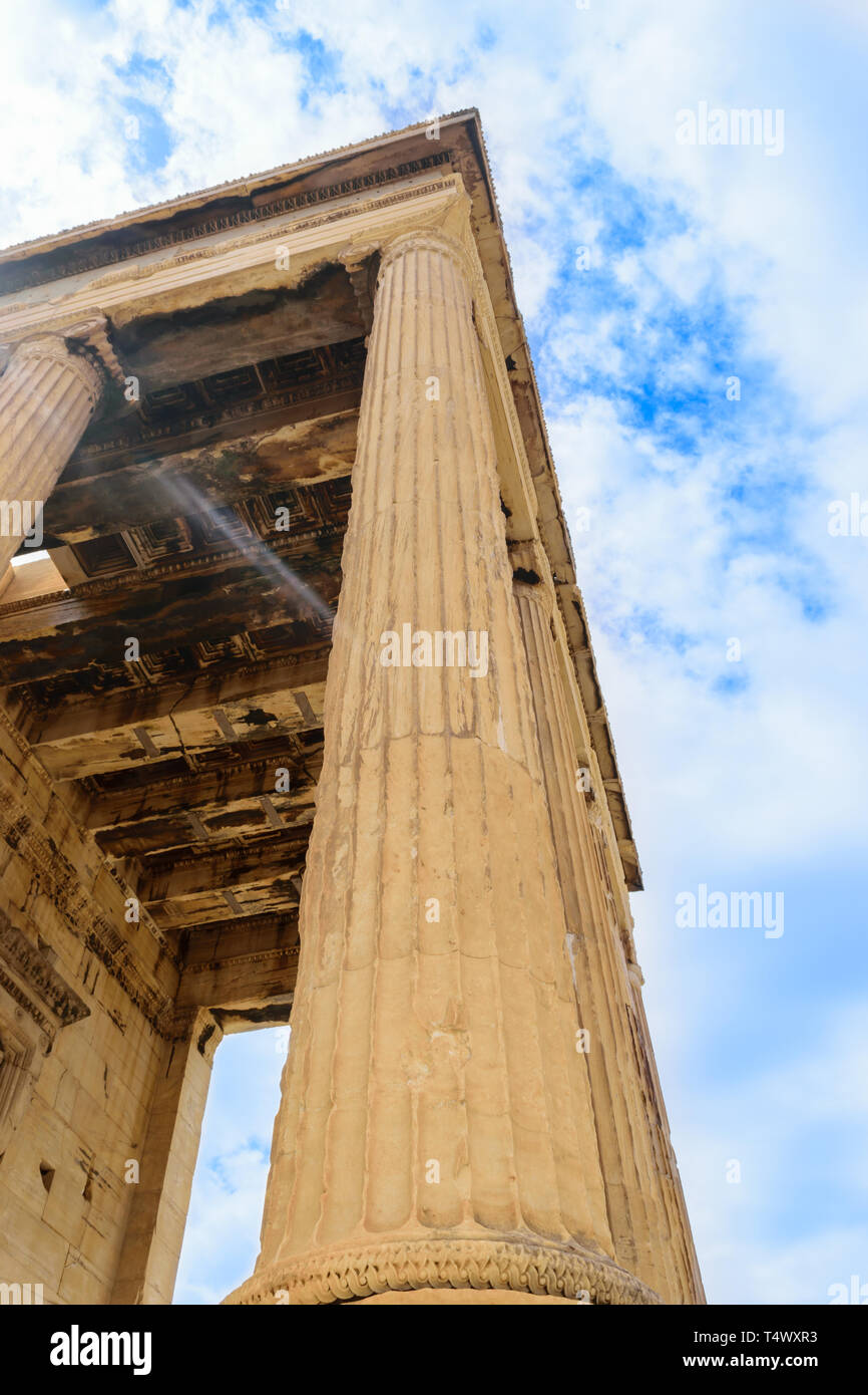 Pillars of Erechtheion ancient Greek temple with sun beam and blue sky ...