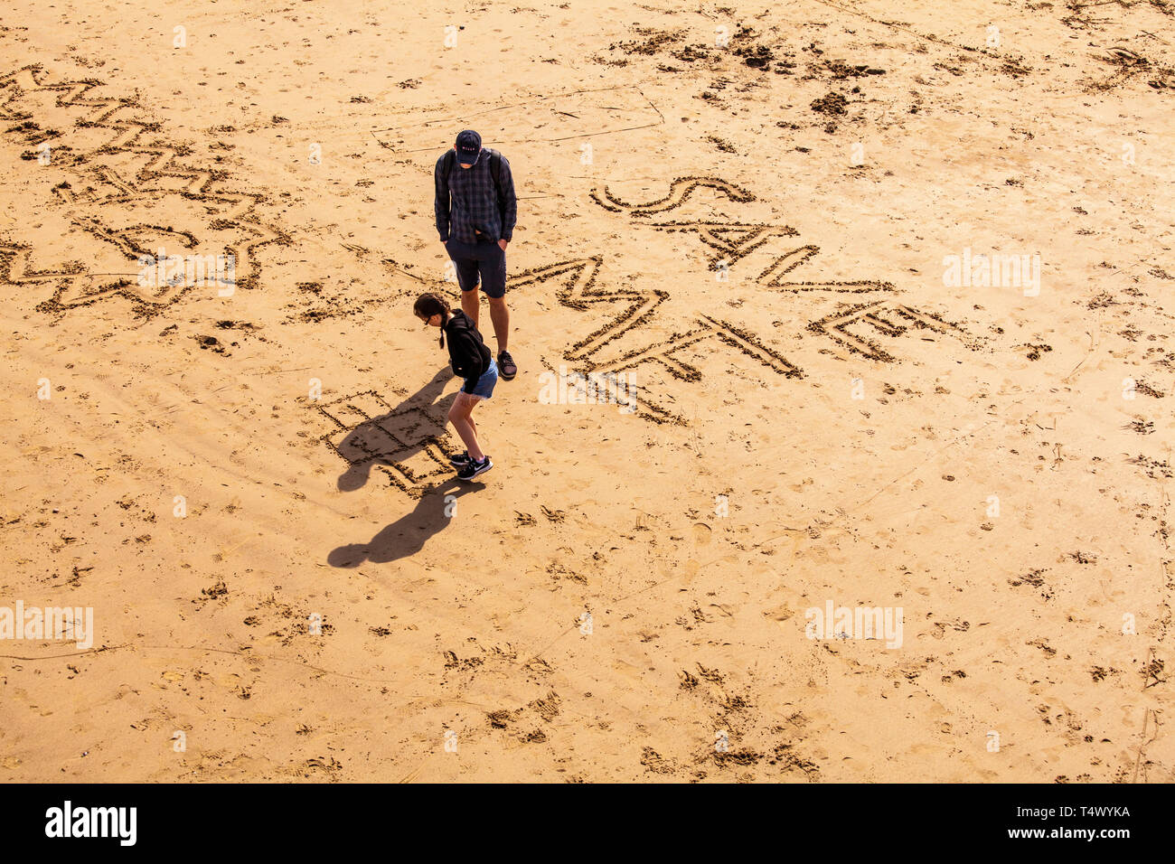 Making signs in the sand hi-res stock photography and images - Alamy