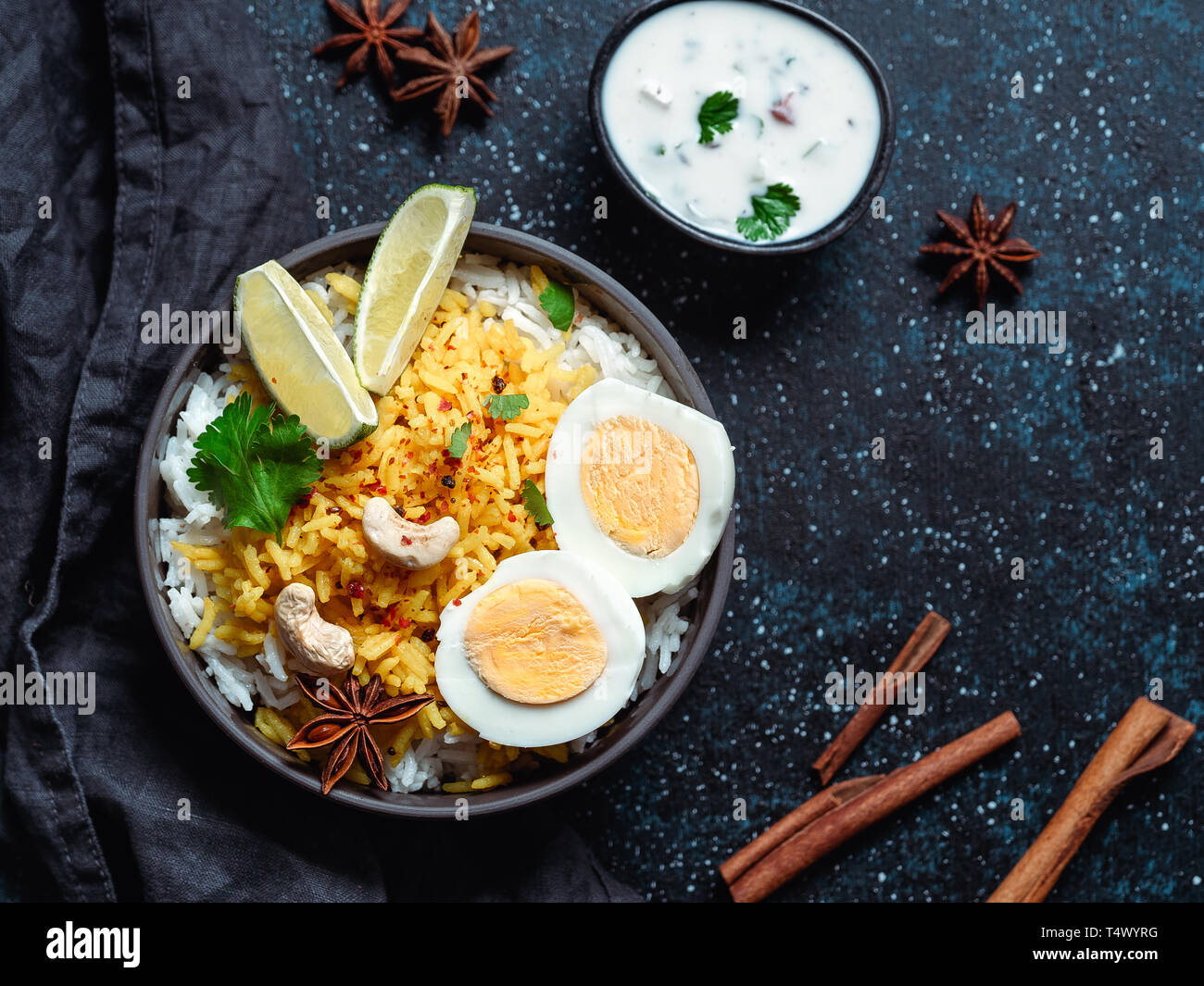 Indian Egg Biryani or anda rice top view on dark background. Egg ...