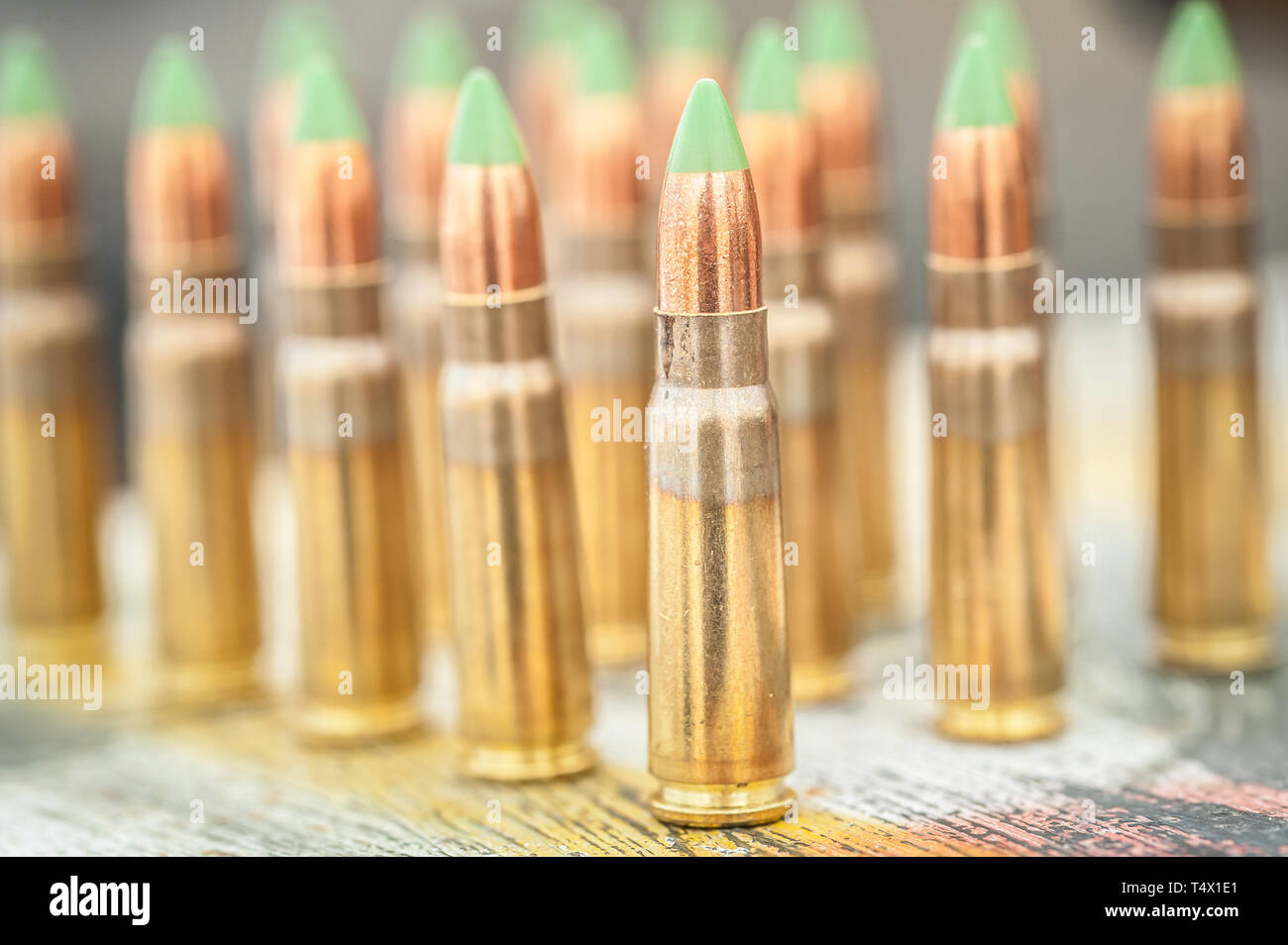 Front view of ammunition for rifle machine gun on the table. Bullets ...