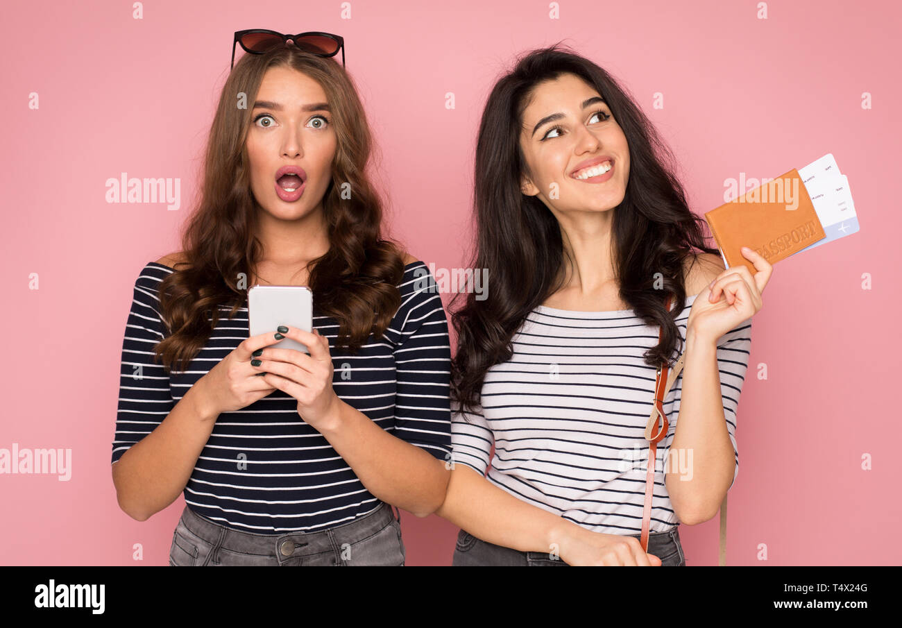 Discounts for tours. Women planning trip, pink background Stock Photo ...