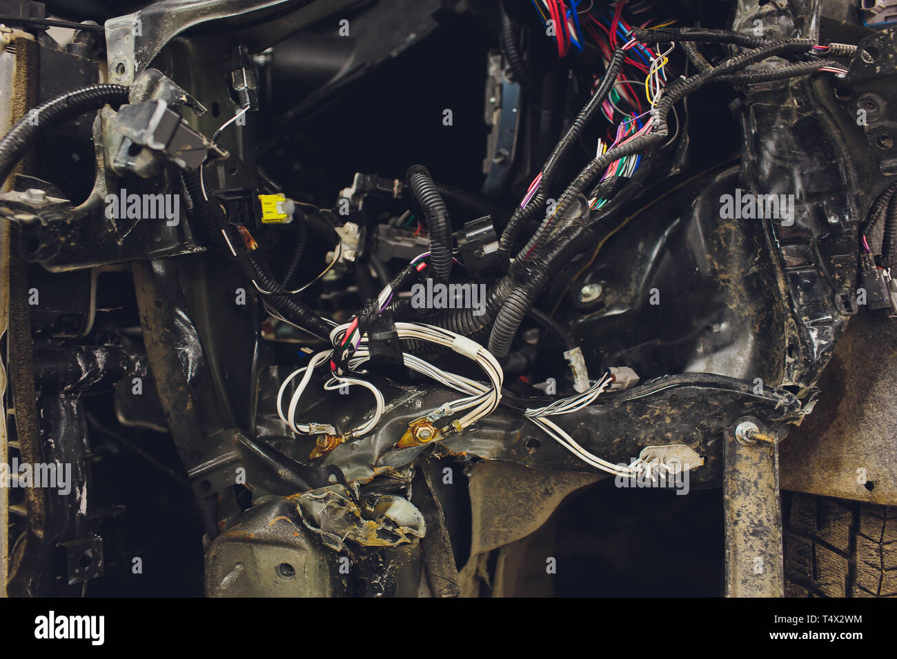 wires from the car wiring lies in the cabin of the dismantled car with ...