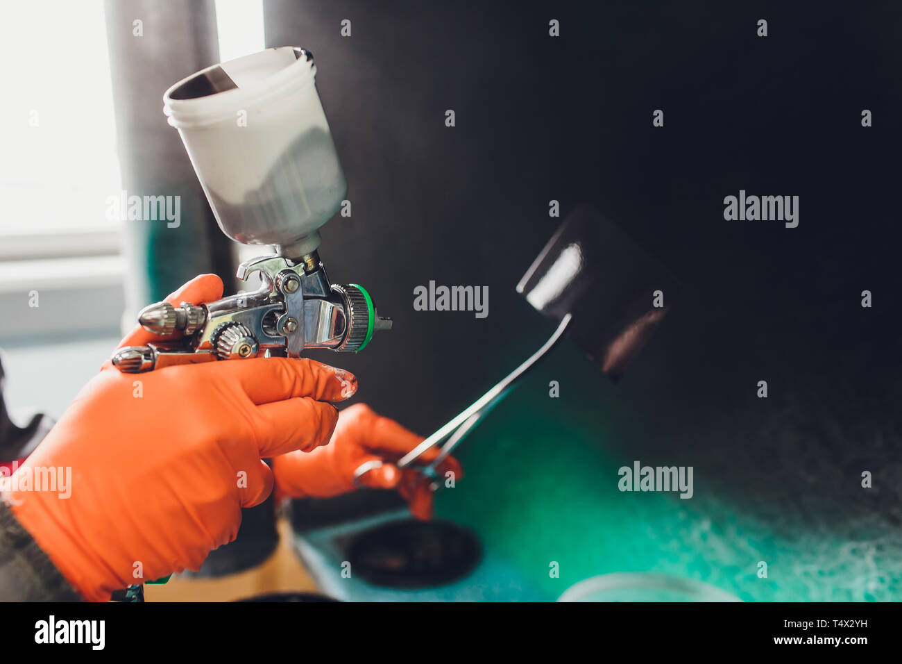 Car repair service. Worker painter checking color matching before ...