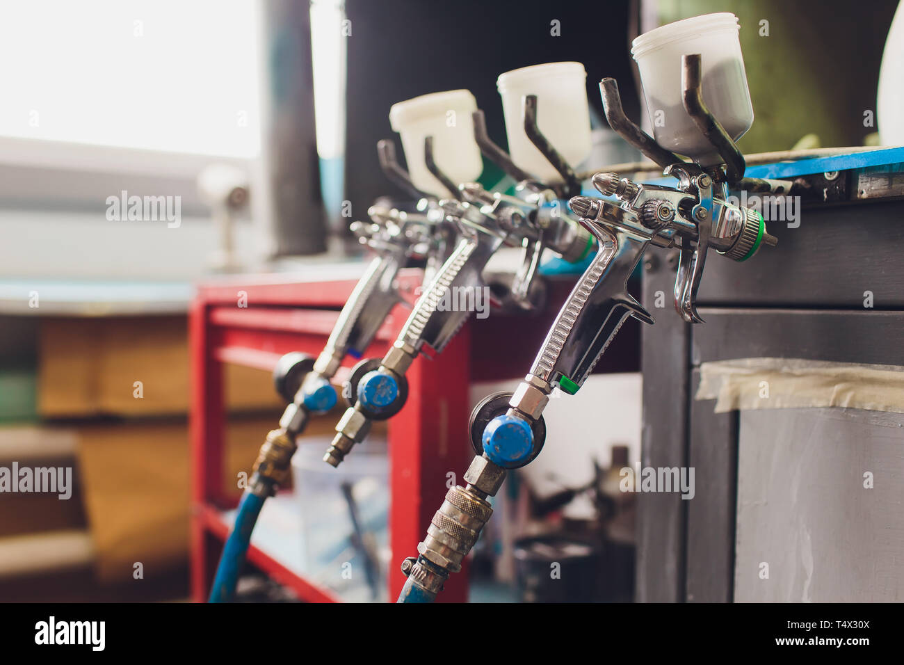 spray gun on wood table. in auto service. used for industrial painting ...