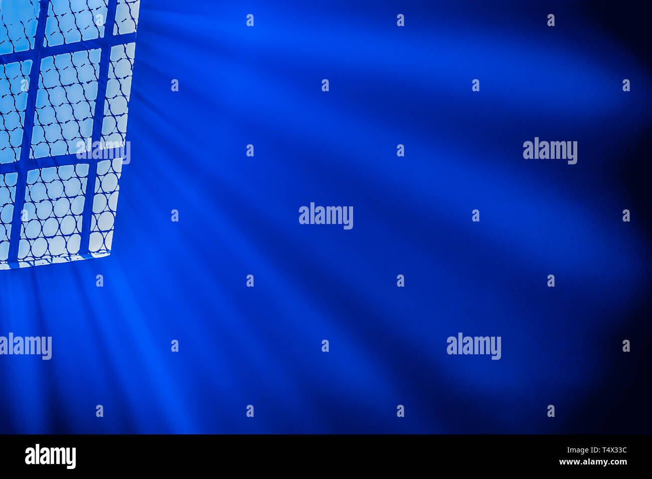 Mystical light. Bright blue light rays through the window Stock Photo ...