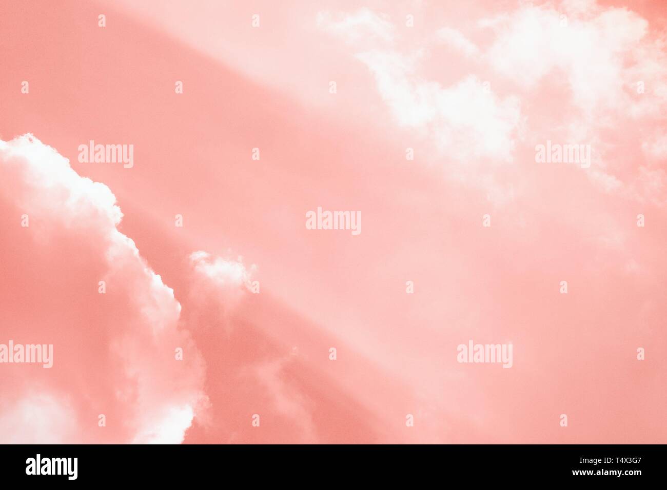 Coral color sky background with white clouds Stock Photo - Alamy