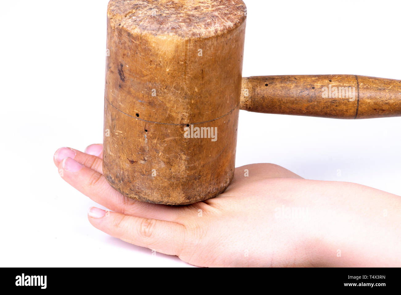 boy hitting his hand with a big wooden hammer Stock Photo - Alamy