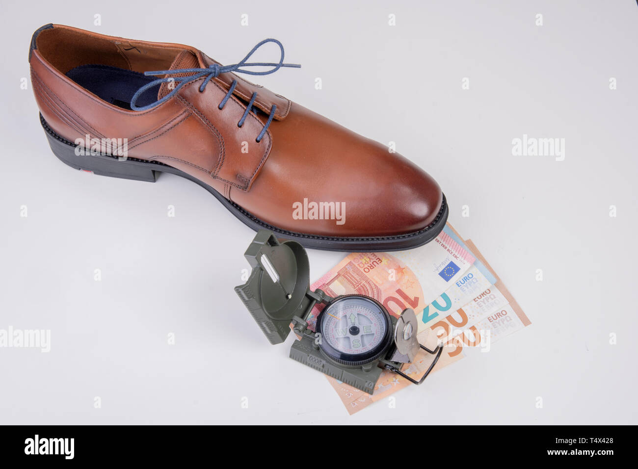 business shoe with compass and euro notes Stock Photo - Alamy