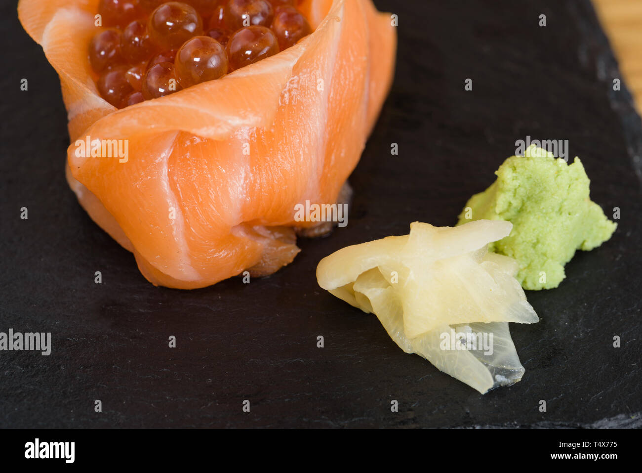 composition of fish food, salmon fillets mounted in the shape of a cup ...