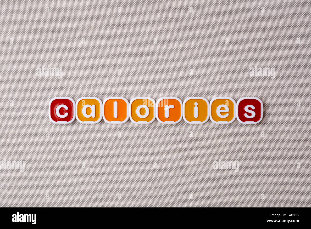 CALORIES word block on fabric background Stock Photo - Alamy