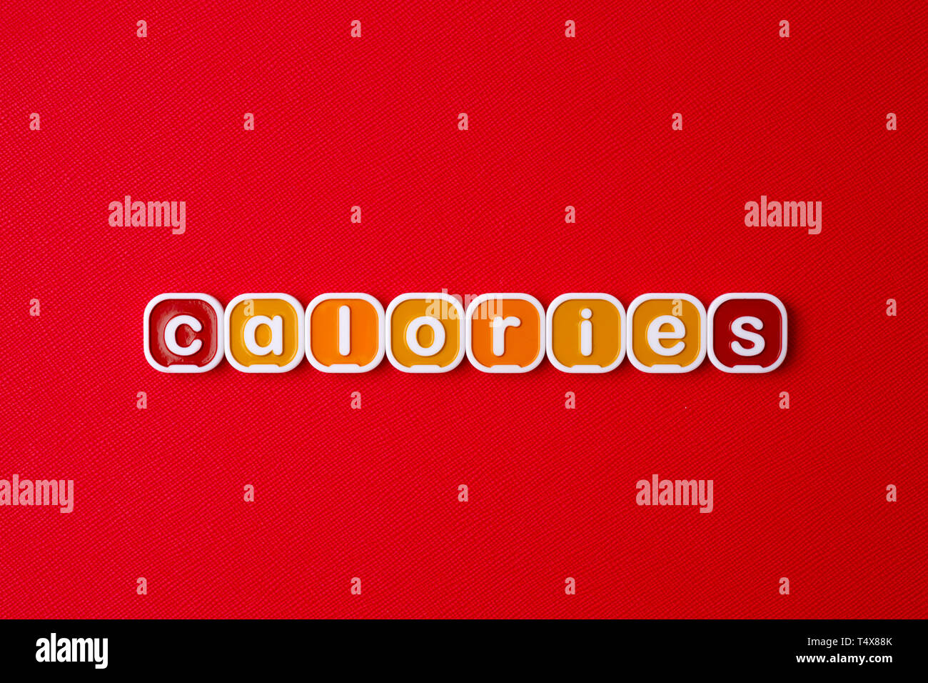 CALORIES word block on RED background Stock Photo - Alamy