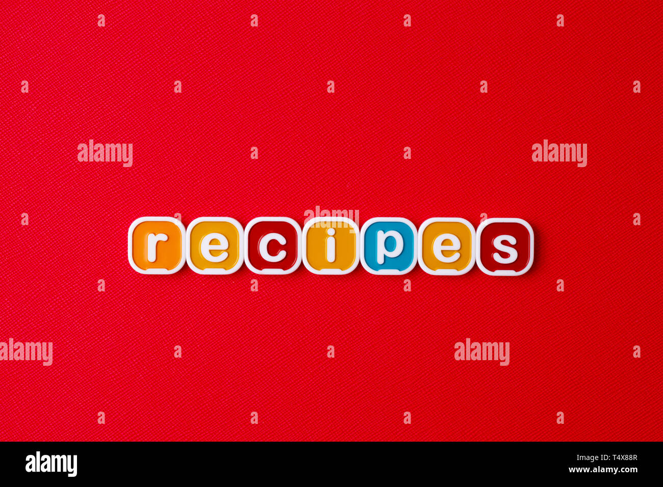 RECIPES word block on RED background Stock Photo - Alamy