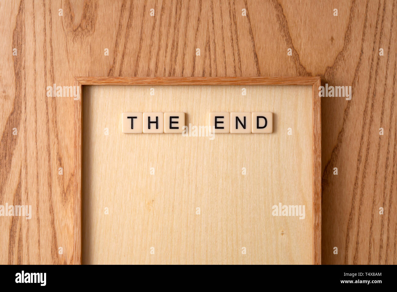 THE END word block on wood background Stock Photo - Alamy