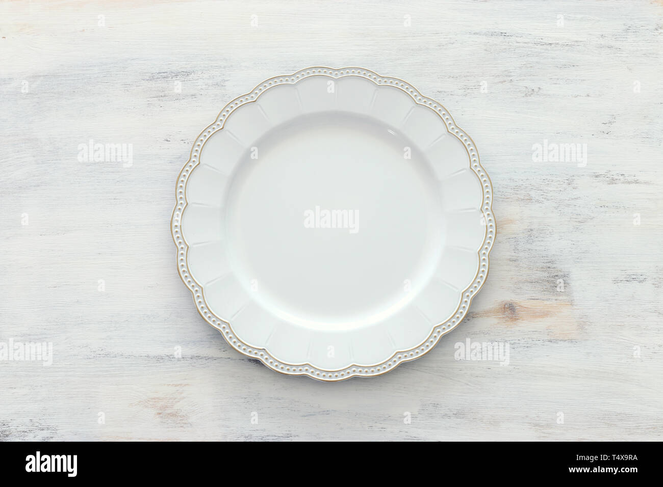 Top view of vintage white empty plate. Flat lay Stock Photo - Alamy