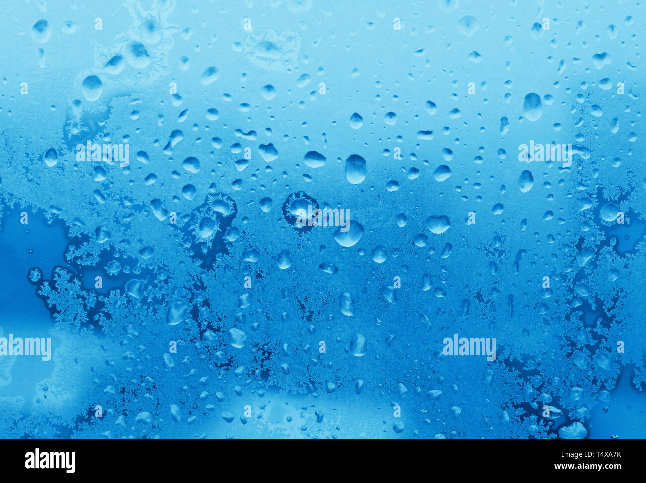 blue ice and water drops on winter glass Stock Photo - Alamy