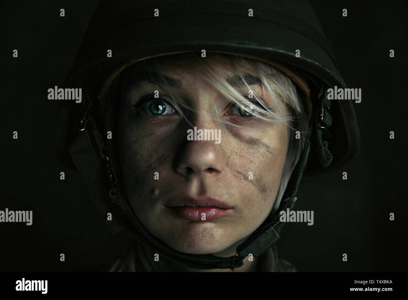 Only one chance to be alive. Close up portrait of young female soldier ...