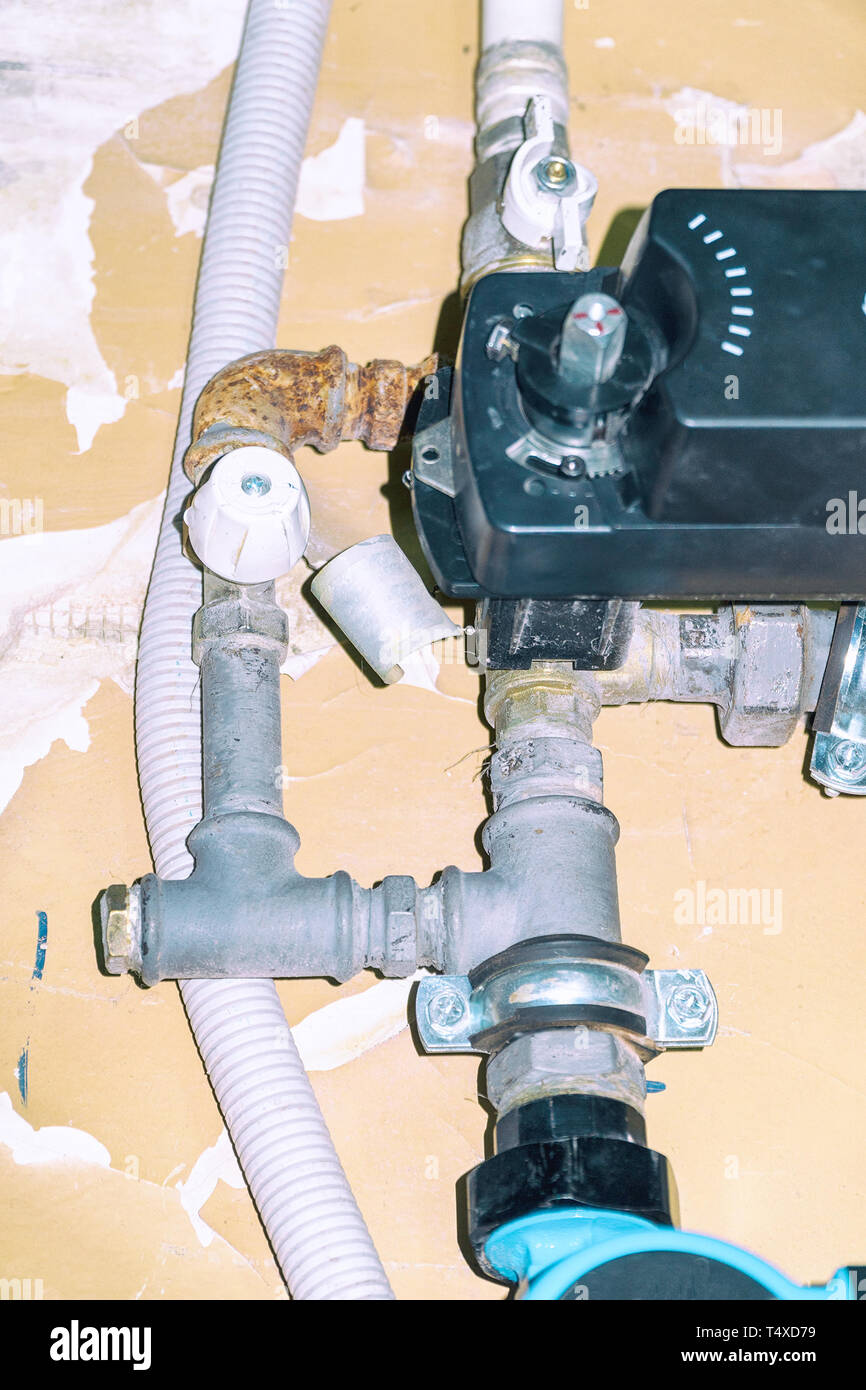 Connection of the supply pump in the home heating system Stock Photo ...