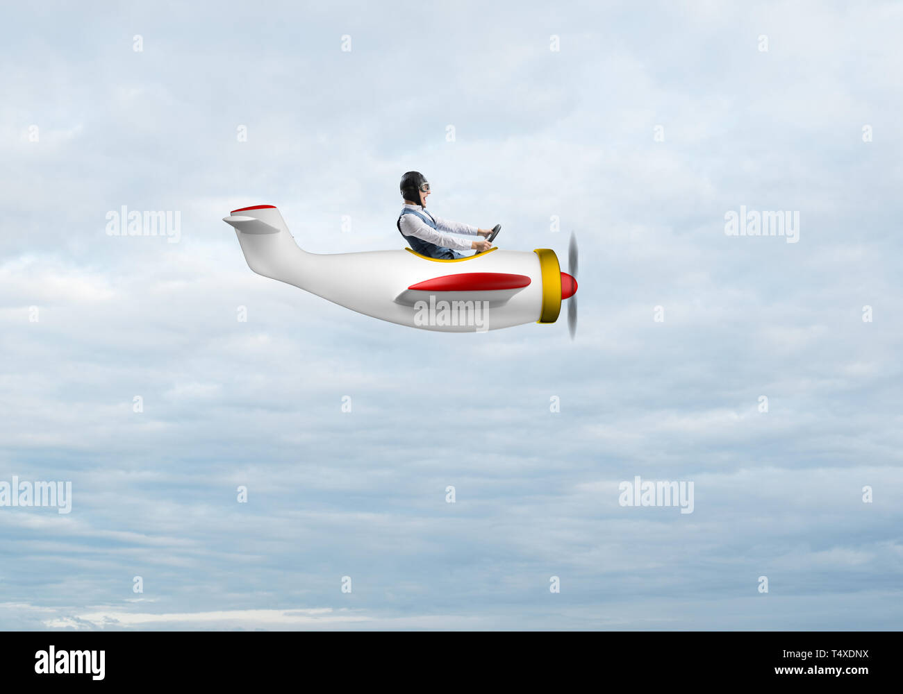 Man in aviator hat driving propeller plane Stock Photo - Alamy