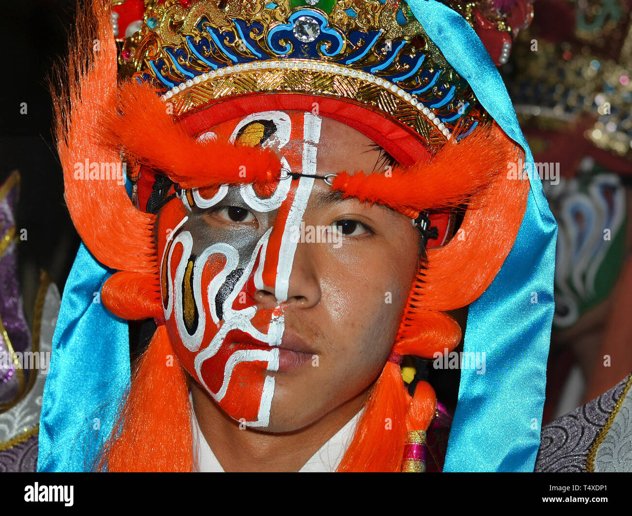 Taiwanese dancer has half of his face painted with a traditional Taoist ...