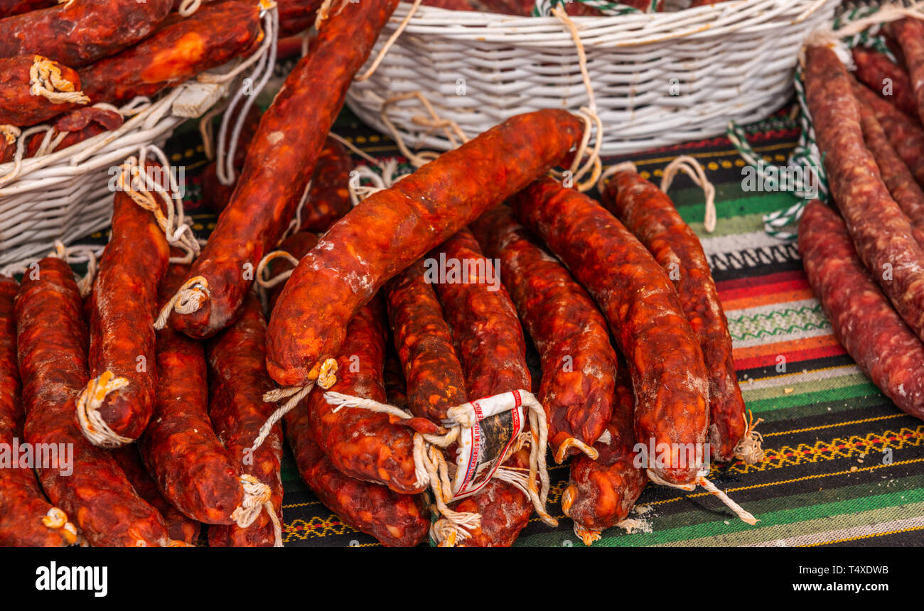 traditional Spanish sausages arranged at the stand, bazaar with food ...