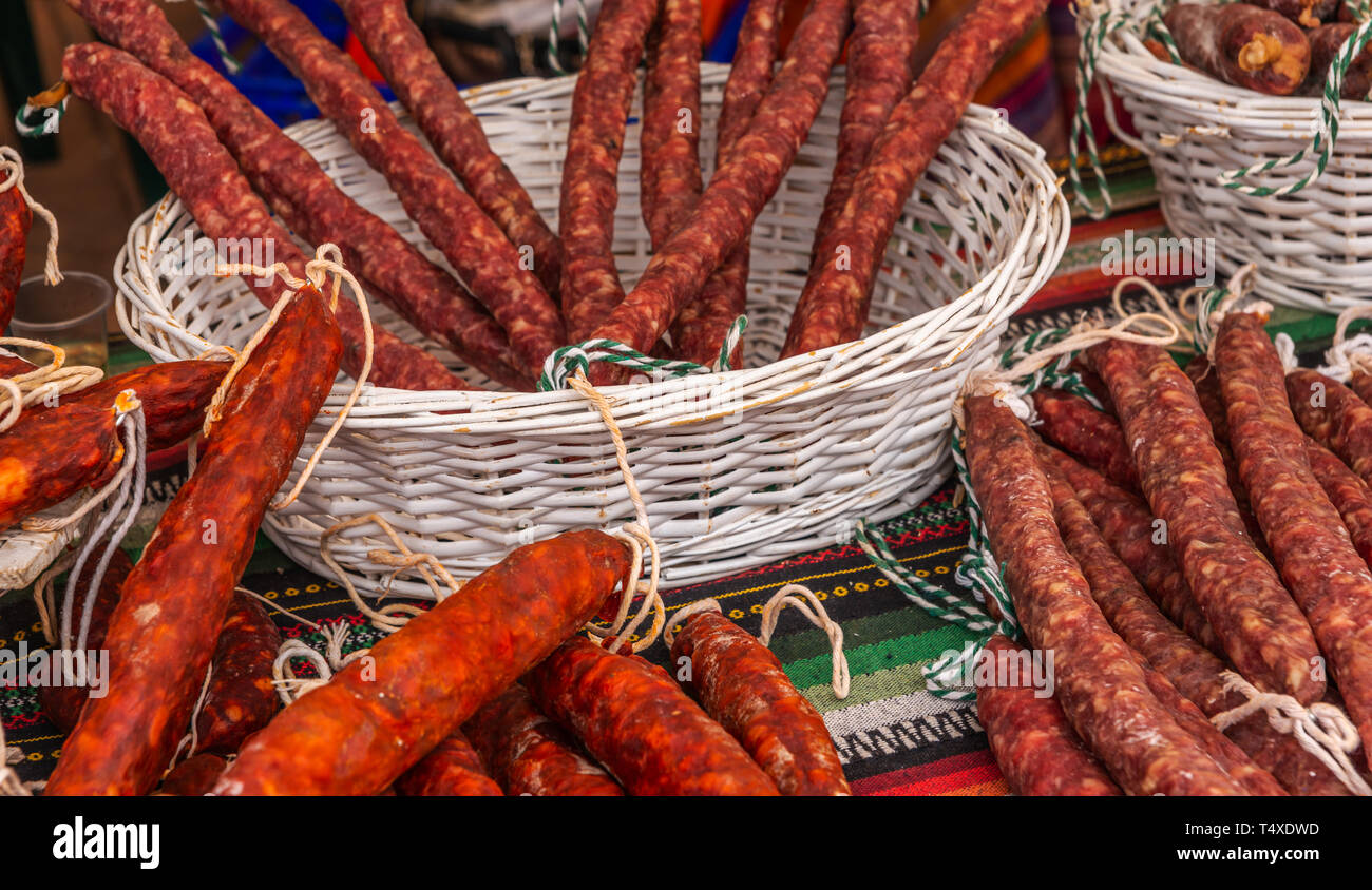 traditional Spanish sausages arranged at the stand, bazaar with food ...