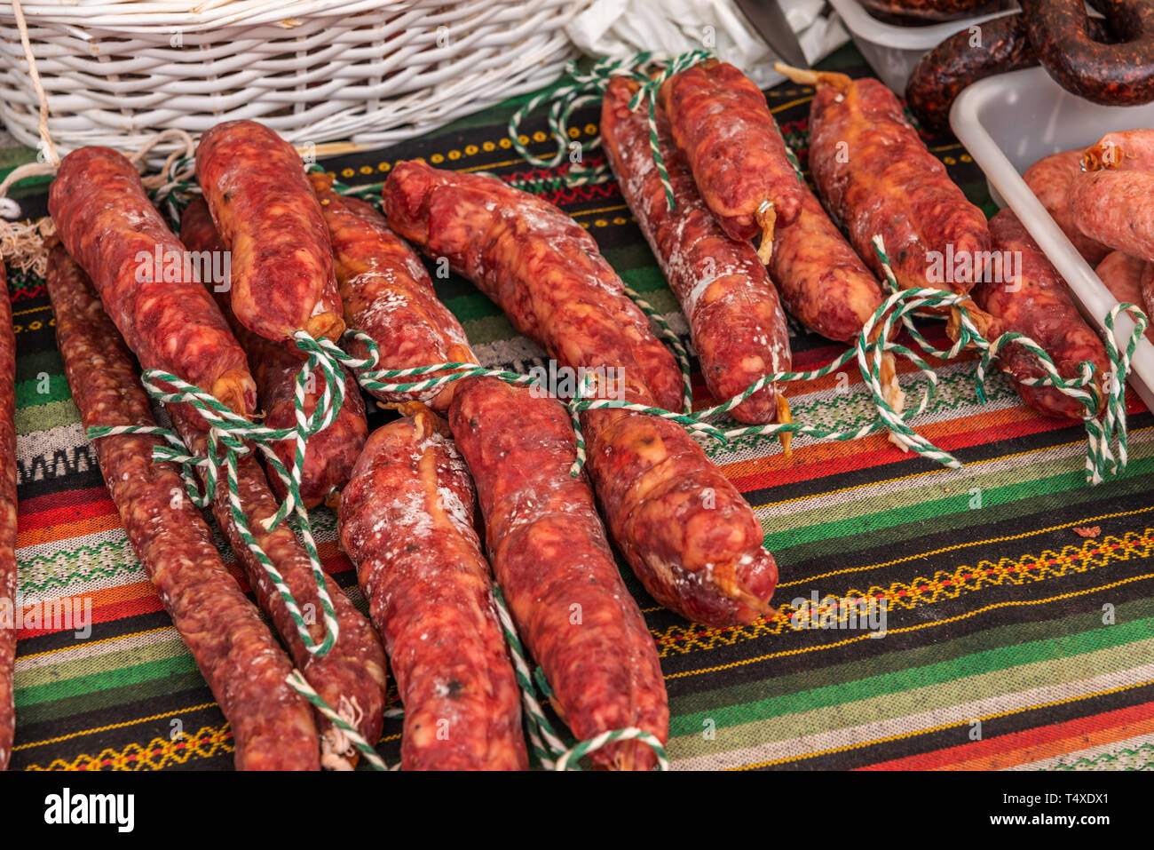 traditional Spanish sausages arranged at the stand, bazaar with food ...