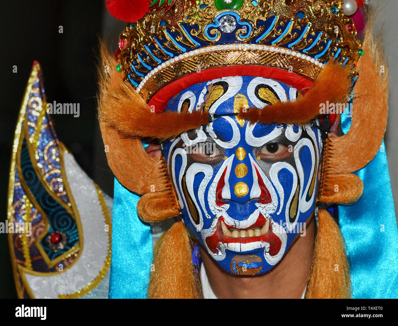 Young Taiwanese dancer wears traditional Taoist warrior face paint, a ...
