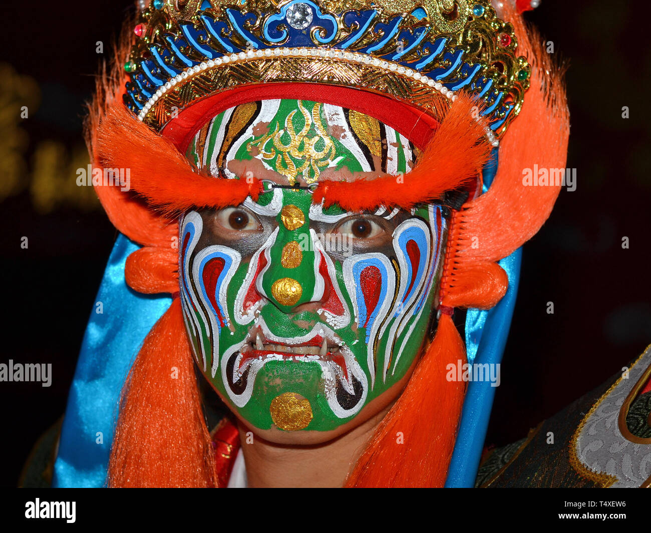 Young Taiwanese dancer wears traditional Taoist warrior face paint, a ...